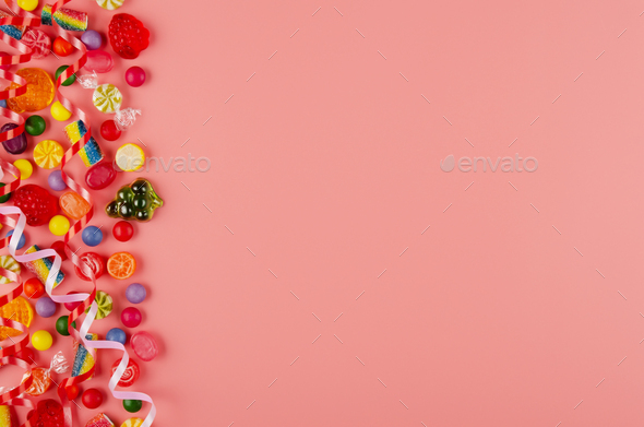 Flat lay view at sweet background of different type color and taste candies Stock Photo by Olena Mykhaylova